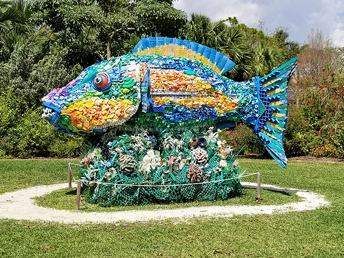 This vibrant mosaic fish sculpture transforms discarded materials into underwater magic, proving one person's trash becomes another's treasure.