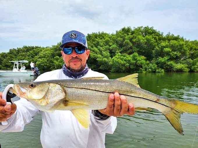 "I caught dinner and bragging rights!" This impressive snook represents hours of patience and seconds of pure adrenaline.