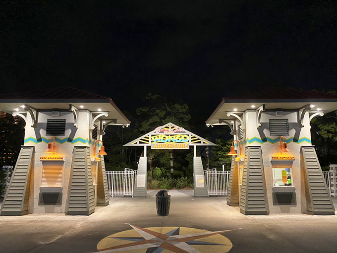 As night falls, the illuminated entrance gates transform into a magical portal, beckoning visitors into Wongo's neon-lit evening persona.