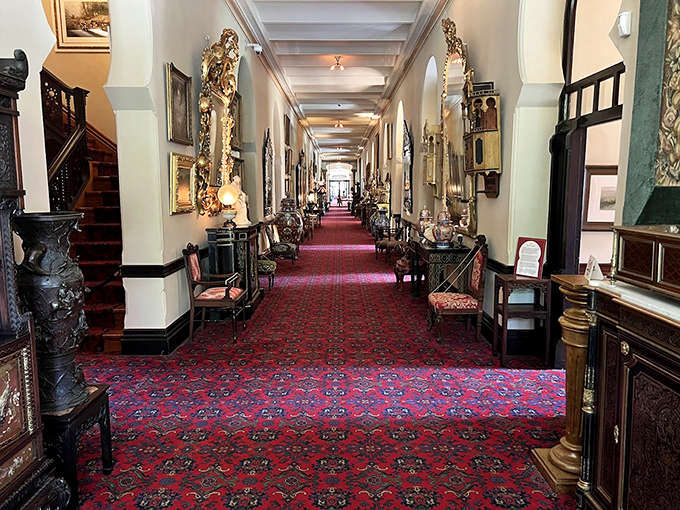 The seemingly endless hallway stretches into history, its walls lined with period furnishings and its rich carpeting muffling footsteps just as it did in 1891.