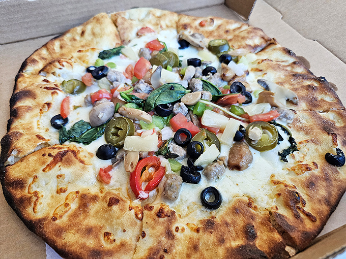 Fresh-baked pizza loaded with colorful toppings emerges from a real pizza oven – miles beyond the frozen variety you'd expect.