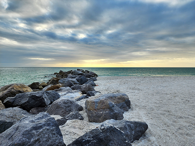 These natural breakwaters create perfect hiding spots for marine creatures, turning a simple beach walk into an expedition of discovery.