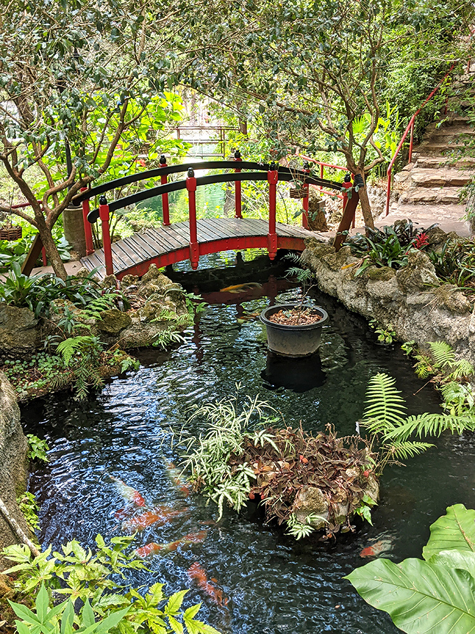 This isn't just a bridge &ndash; it's a crimson comma in nature's story, connecting garden chapters with architectural flair.