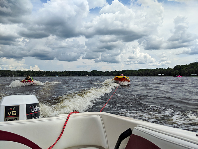Water sports on Lake Santa Fe: where "getting dragged behind a boat at alarming speeds" somehow translates to "best family memory ever."