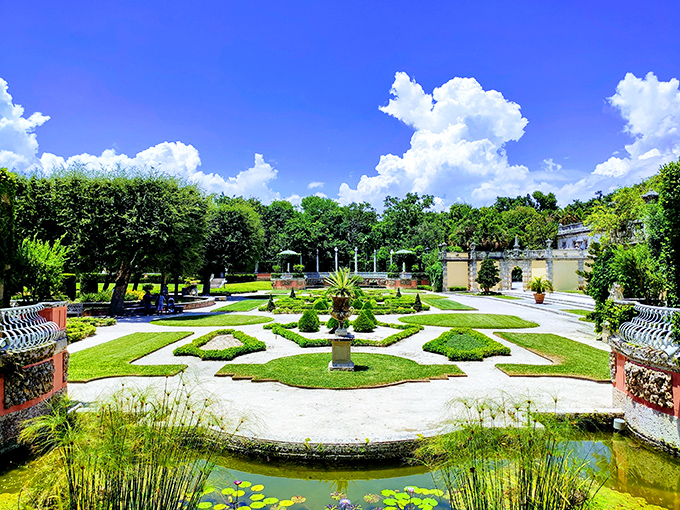 Geometric garden patterns create living artwork at Vizcaya, where carefully trimmed hedges form outdoor rooms.