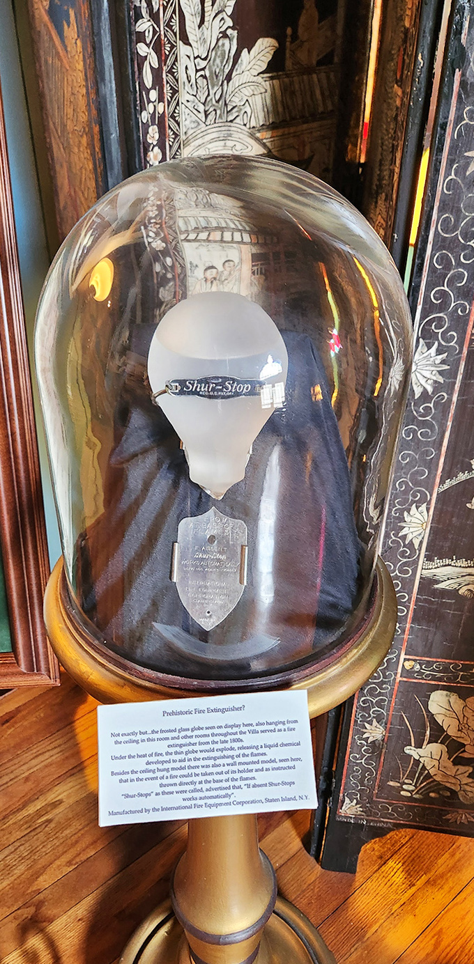 The weathered facade of the old Coast Guard building tells tales of maritime history as tourists explore Mallory Square.