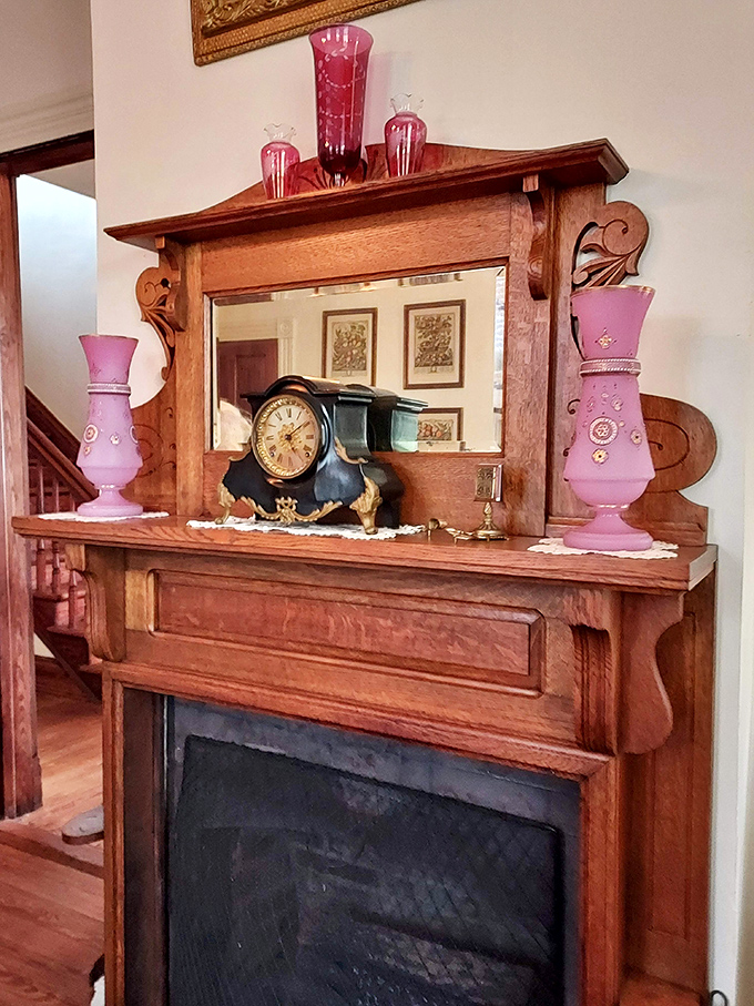 The oak fireplace mantel isn't just decorative &ndash; it's a Victorian Instagram wall, displaying treasures and status symbols instead of selfies.