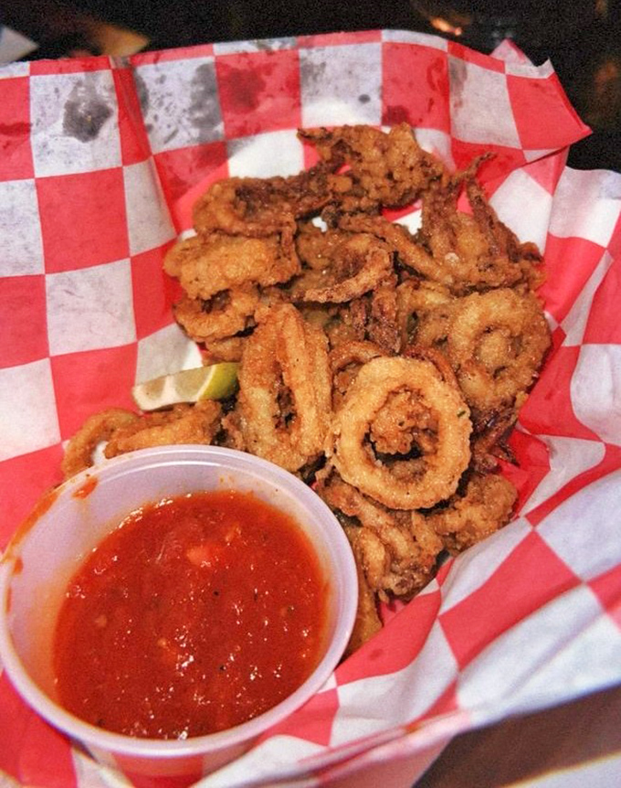 Crispy calamari rings served with tangy marinara &ndash; seafood so fresh you'd think it was just plucked from the depths below deck.