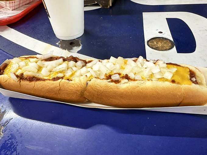 The classic Coney experience &ndash; a perfectly cooked dog nestled in a soft bun, smothered with homemade chili, cheese, and diced onions.