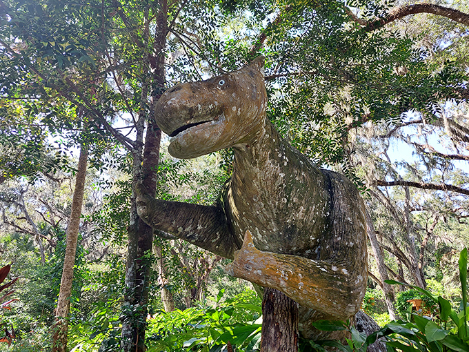 "Excuse me, do you have a moment to talk about the Late Cretaceous period?" This concrete dinosaur has been practicing his conversation starter for decades.