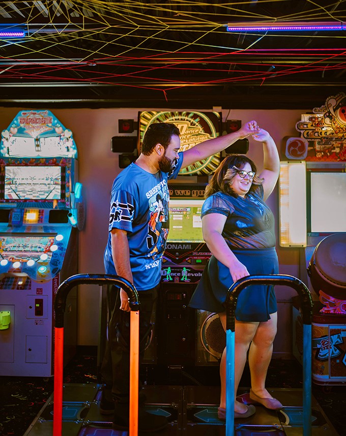 Dance revolution in progress: Two players finding rhythm together in a sea of flashing arrows. Romance isn't dead; it just has a killer soundtrack now.