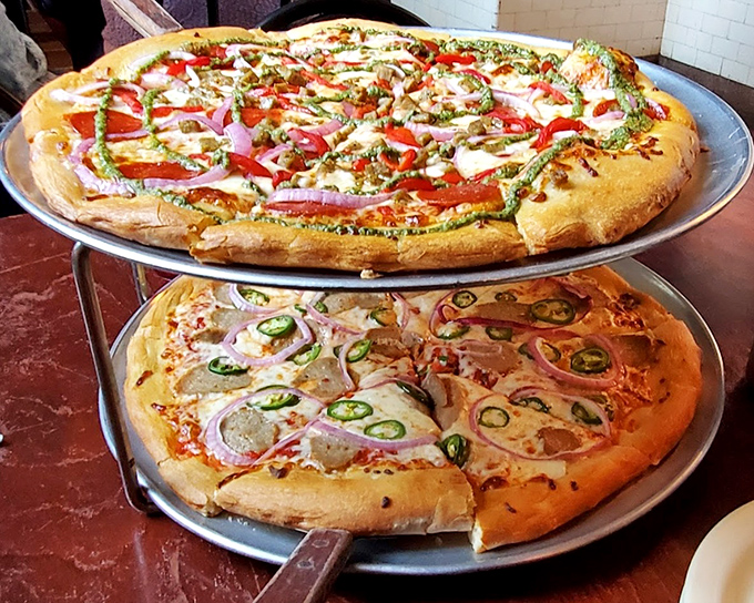 Two tiers of pizza perfection &ndash; the bottom pie featuring jalape&ntilde;os for those who like their haunted hospital visit with a kick.