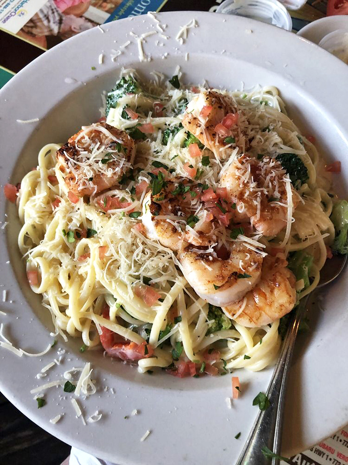 This seafood fettuccine doesn't just have shrimp &ndash; it's practically a census of the local marine population, all bathed in creamy goodness.
