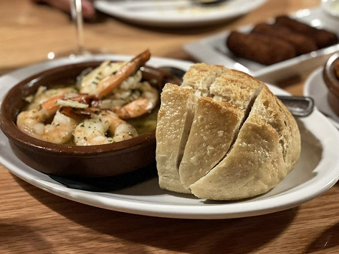 Gambas Al Ajillo &ndash; where plump shrimp bathe in garlicky olive oil so good you'll want to drink it with a straw.