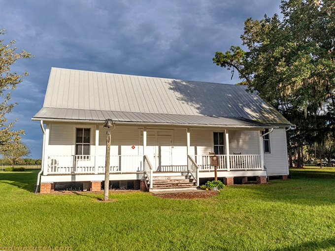 This pristine pioneer house stands as testament to Florida frontier resilience&mdash;white clapboard defying time while modern visitors snap selfies.