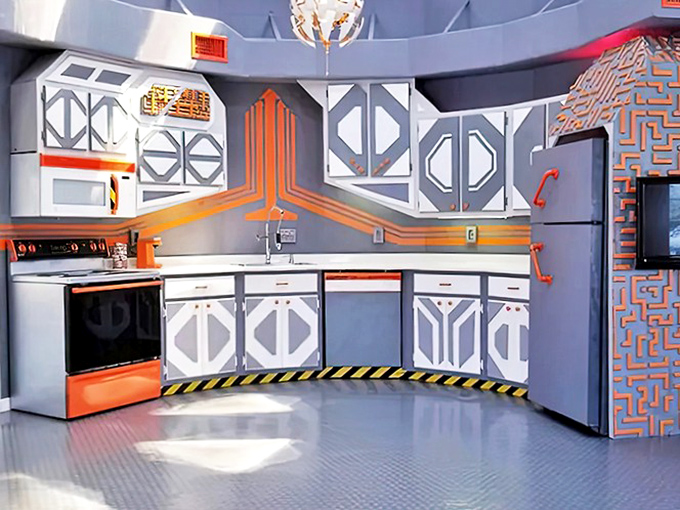 This kitchen boldly goes where no beach house kitchen has gone before, with geometric cabinets and a ceiling that's pure retro-futuristic art.