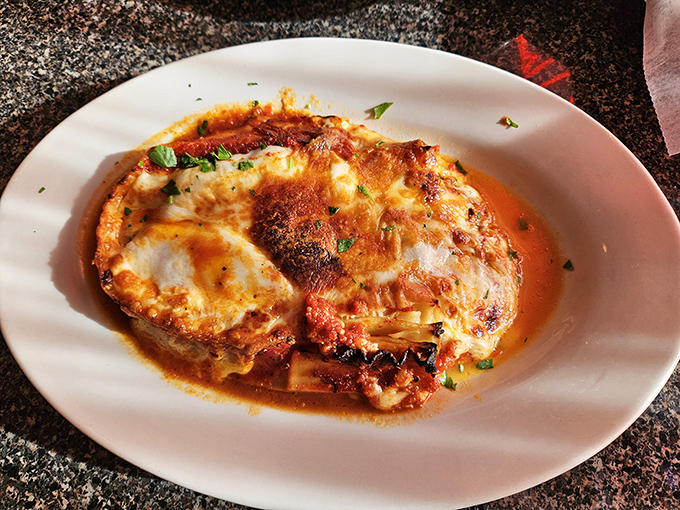 Lasagna that arrives still bubbling at the edges &ndash; layers of pasta, cheese, and robust sauce creating an architectural masterpiece on your plate.