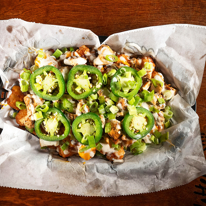 Jalape&ntilde;os, cheese, and green onions transform ordinary fries into an extraordinary experience that demands to be shared &ndash; but you won't want to.