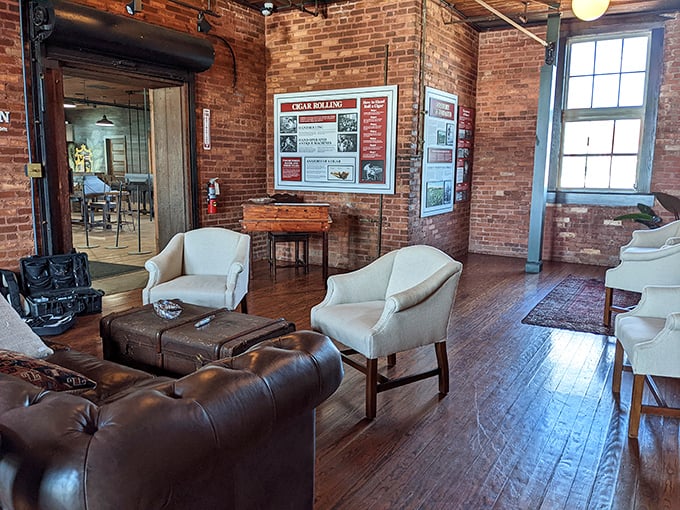 Comfortable leather seating invites visitors to linger in this tastefully appointed lounge. The brick walls practically radiate stories from another time.