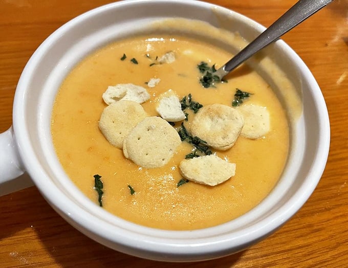The lobster bisque arrives like a warm hug in a bowl &ndash; velvety, rich, and studded with tender morsels that make each spoonful a treasure hunt.