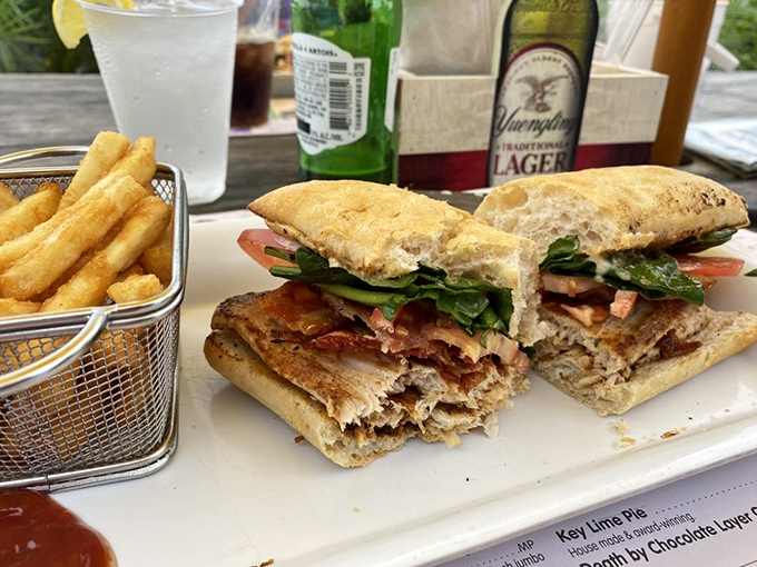 A sandwich worth writing home about &ndash; fresh greens, juicy tomatoes, and that perfectly grilled fish make every bite memorable.