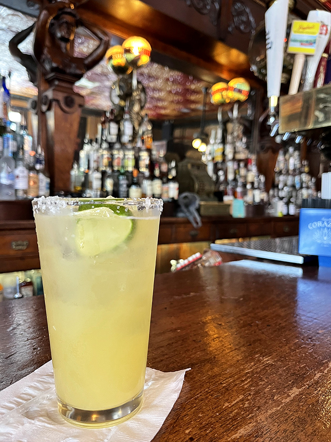 The Palace's margarita arrives in all its lime-garnished glory, the salt rim glistening like the nearby Atlantic on a sunny Florida afternoon.