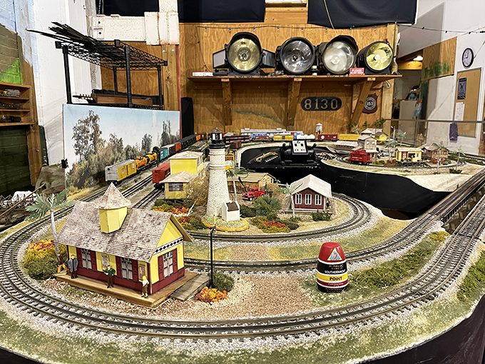 Miniature worlds capture railroading in perfect detail, where tiny passengers wait on platforms and diminutive trains circle landscapes crafted with loving precision.