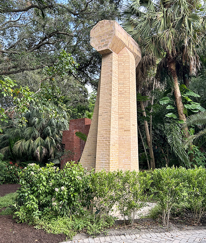 Monument Number 8 reaches skyward like a modern totem, its pale bricks catching the tropical sunlight with quiet dignity.