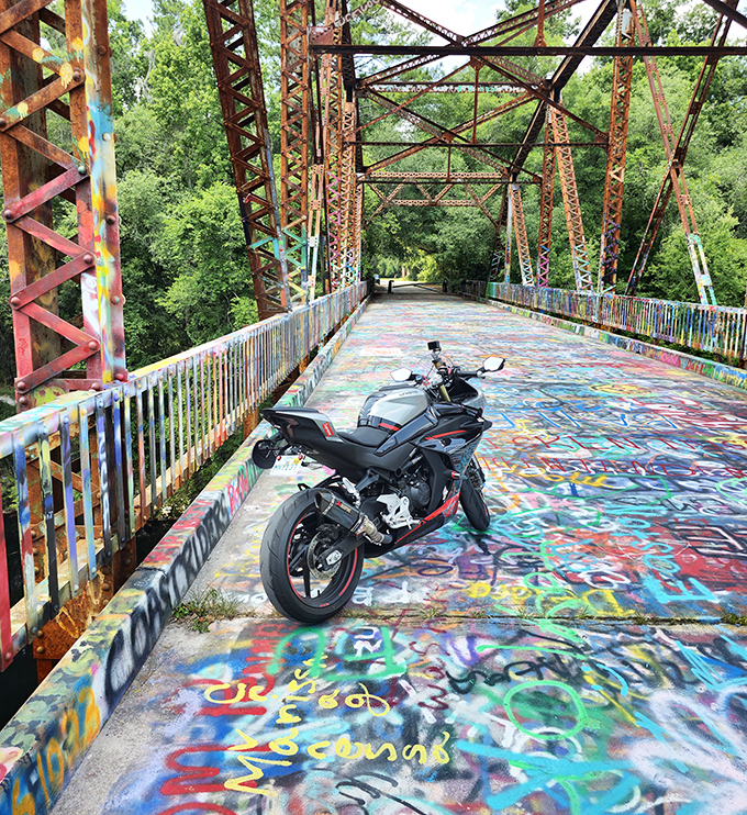 Even motorcyclists make the pilgrimage to this hidden gem, parking their rides on the technicolor surface for photos worth the journey.