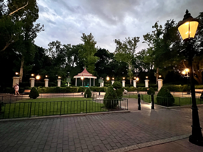 As twilight falls, the pavilion transforms into a magical evening scene. Gas lamps illuminate cobblestone paths that practically beg for a romantic stroll.