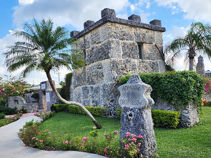 Flowering plants cascade over the coral walls, adding a touch of romance to this monument built for a love that never materialized.