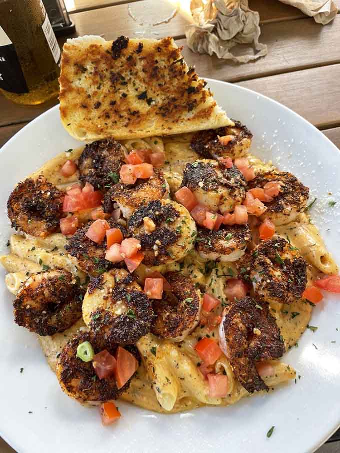 Cajun pasta loaded with seafood brings Louisiana heat to Florida's coast, creating a fusion that works better than it has any right to.