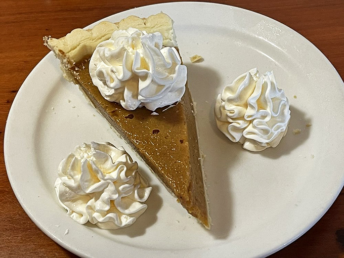 This slice of pumpkin pie isn't just dessert &ndash; it's a cloud of autumn spices topped with whipped cream islands.