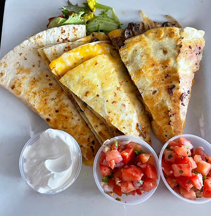Quesadilla: Cheese pulls for days with this quesadilla &ndash; crispy tortilla exterior giving way to a molten interior that demands to be photographed.