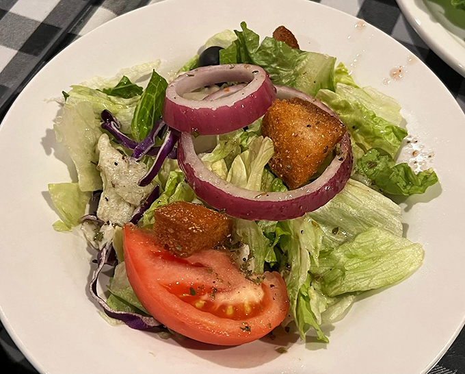 Even the salad knows its supporting role, a crisp, fresh palate cleanser that prepares you for the meaty main event. 