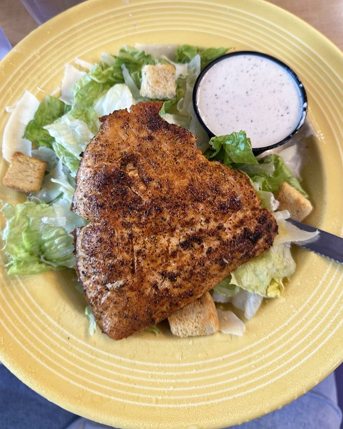 The Salmon Caesar Salad proves healthy eating needn't be punishment – perfectly seasoned fish atop crisp romaine with house-made dressing that zingers.