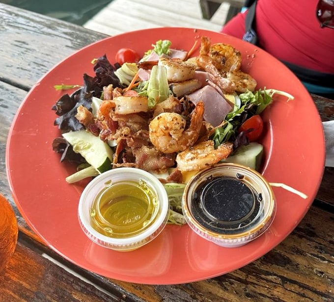 A colorful celebration of local shrimp dancing atop fresh greens &ndash; because sometimes you need something lighter between sandwich binges.