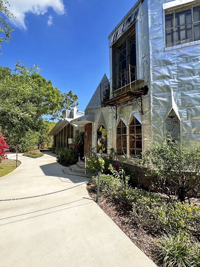 Every angle of the castle reveals new details, with the afternoon sun transforming the aluminum exterior into a canvas of light and shadow.