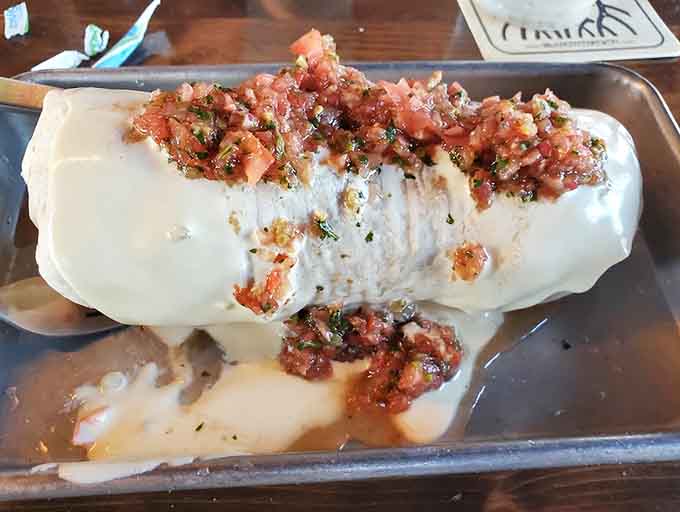 The Soaker lives up to its name, a generously sauced burrito that requires strategic napkin placement and zero regrets about your life choices.