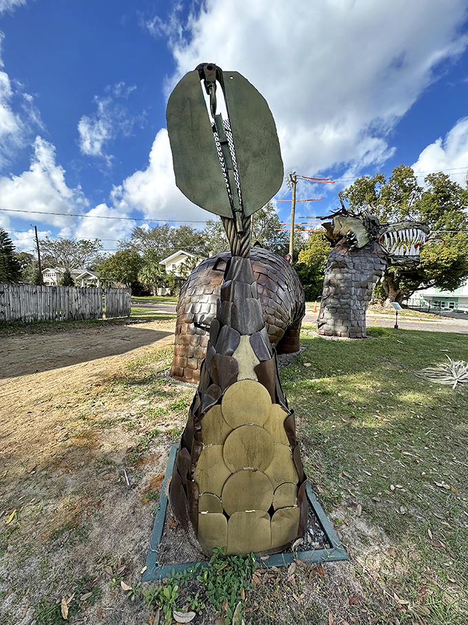 The dragon's tail curves gracefully, showcasing the artist's ability to create organic, flowing forms from rigid industrial materials &ndash; metal has never looked so alive.
