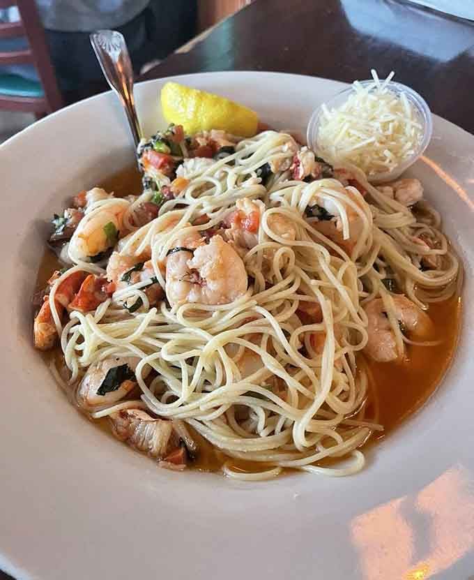 Shrimp pasta twirled with garlic and butter creates the kind of dish that makes you want to propose to your fork.
