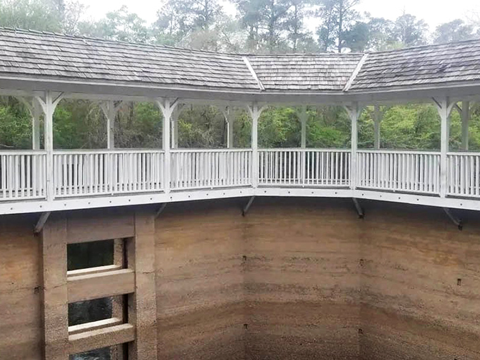 The architectural time capsule reveals itself &ndash; elegant white railings above, sturdy tabby walls below, with a ladder connecting past to present like some Victorian-era Escher drawing.