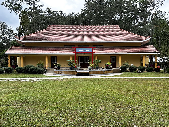 The main temple building combines traditional Asian architectural elements with practical adaptations to Florida's climate and environment.