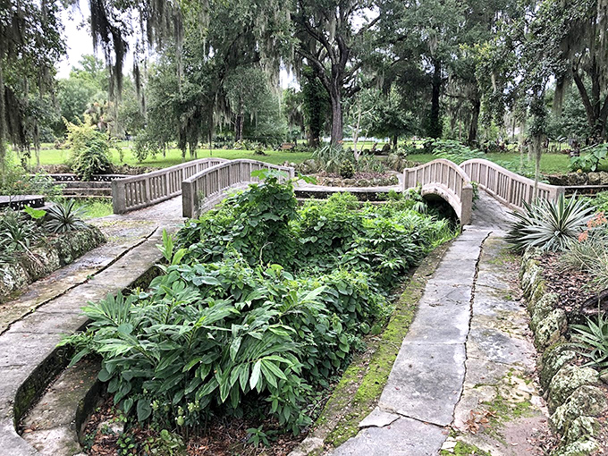 Twin concrete bridges span the garden like something from a fairy tale &ndash; the kind where the protagonist should probably turn back.
