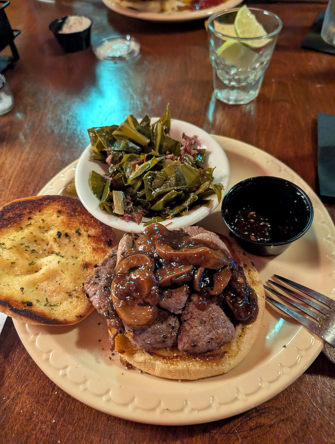 The venison sandwich offers the restaurant's star protein in a more casual presentation, topped with saut&eacute;ed mushrooms and served with collards.