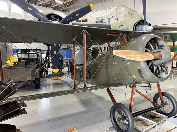 This olive-drab scout biplane with its wooden struts and canvas skin represents aviation's infancy, when pilots flew with more courage than instruments.