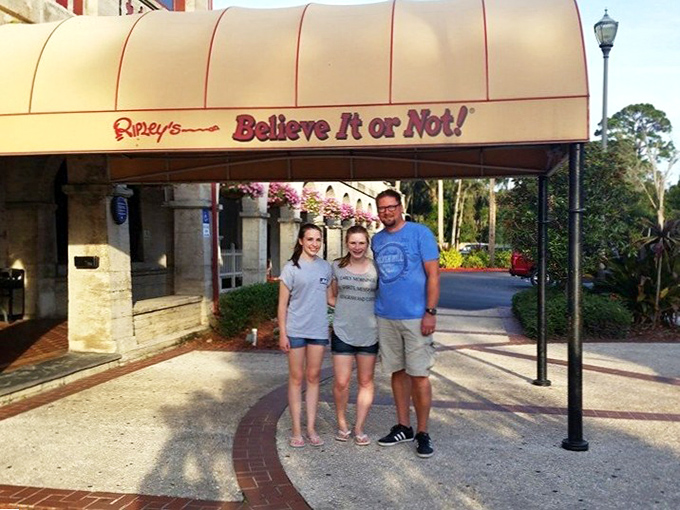 Families create lasting memories at Ripley's entrance, where the adventure into oddities and curiosities begins with smiles and anticipation.