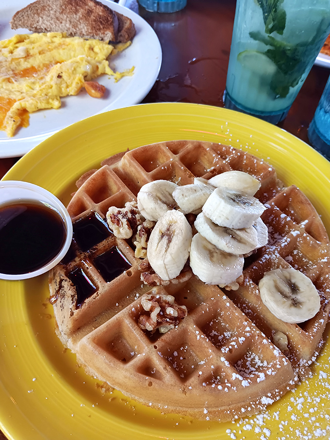 Waffles: Breakfast architecture at its finest &ndash; golden squares topped with bananas and powdered sugar that would make your cardiologist wince and your taste buds sing.