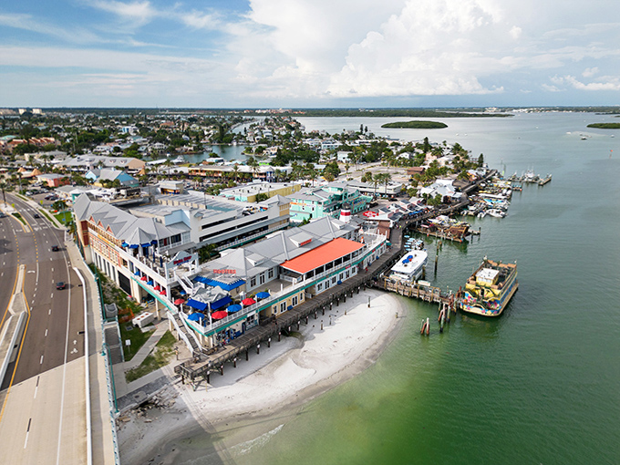 John's Pass Village bustles with activity – a colorful waterfront complex where shopping, dining, and boating converge.