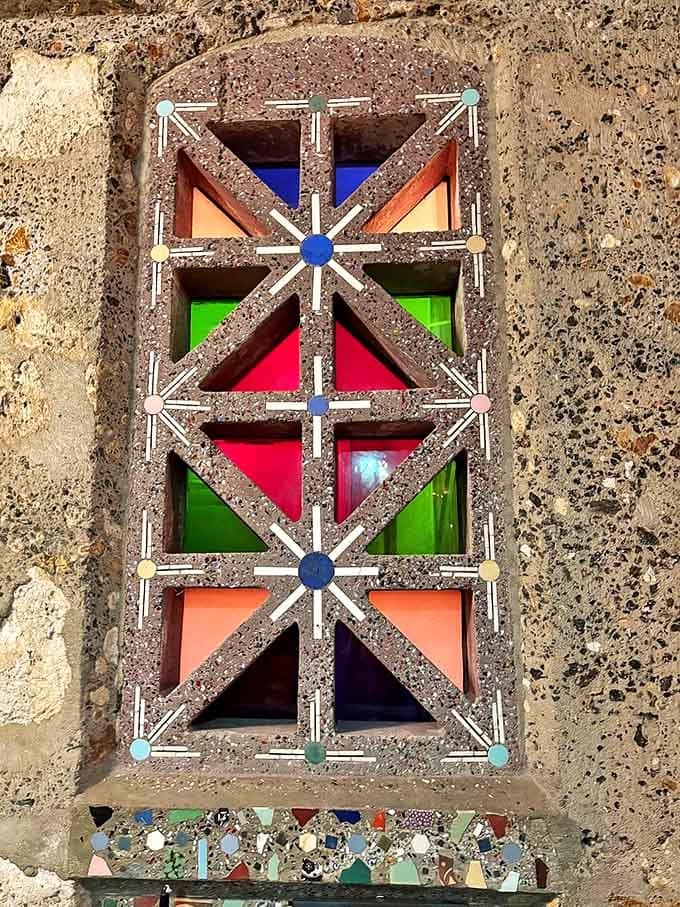 Stained glass geometric patterns filter Florida sunshine into kaleidoscopic displays, turning ordinary windows into daily light shows for fortunate visitors.